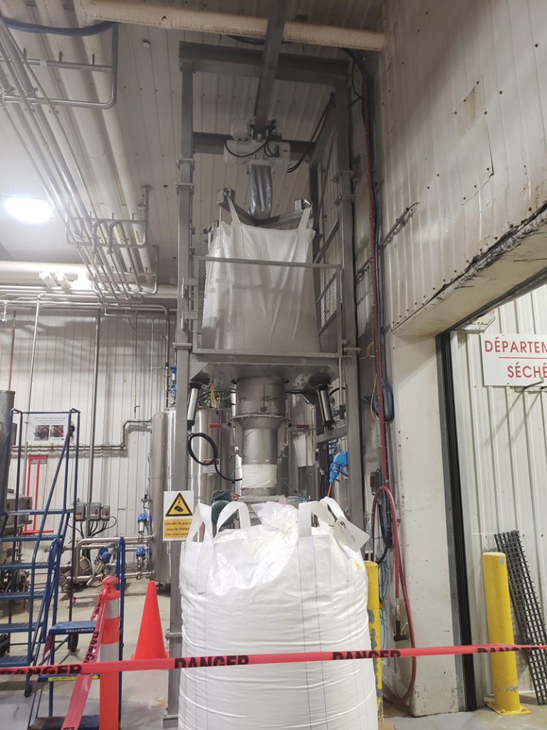 Bulk bag unloading station and lifting auger for sugar handling - Con-V-Air